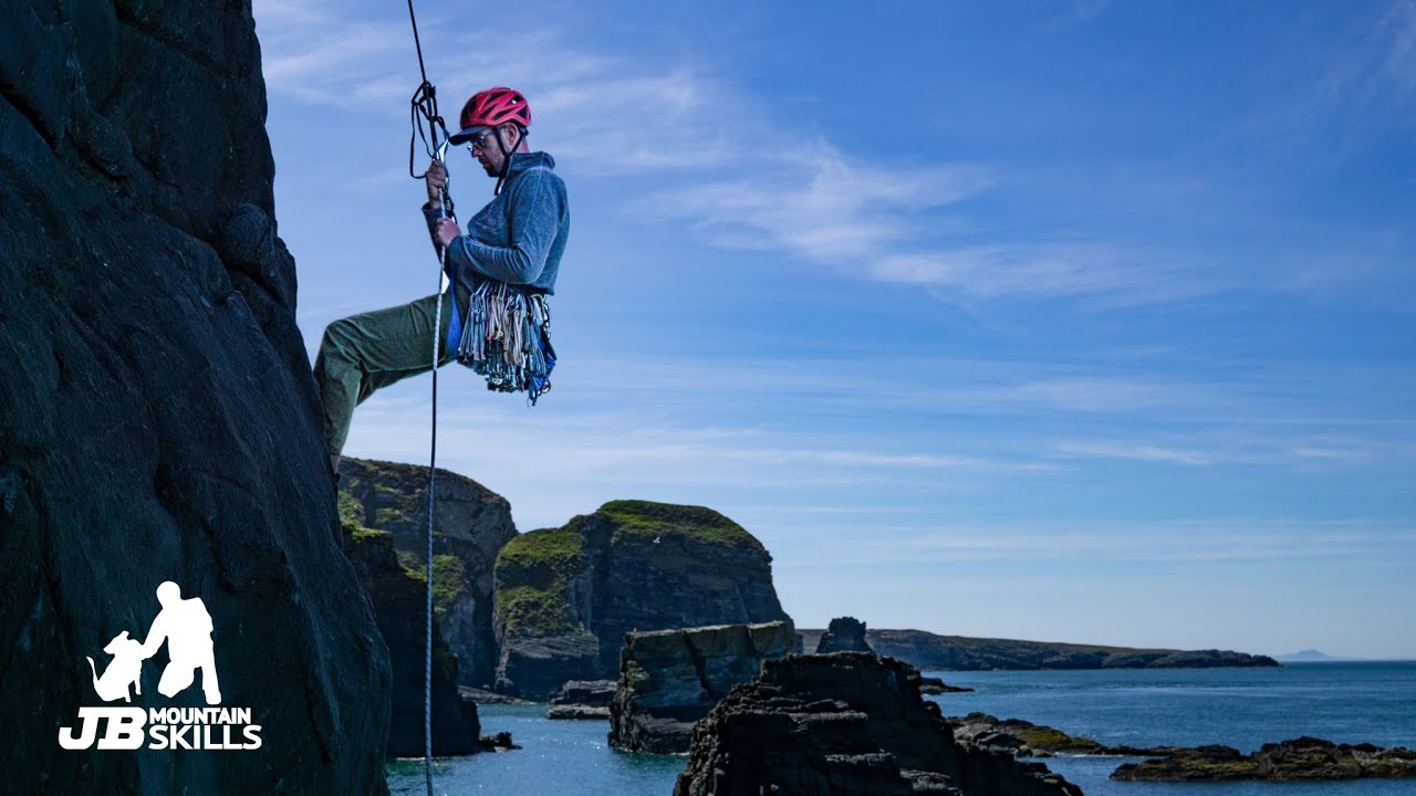 How to pass a knot when abseiling / rappelling and lowering - Climbing ...
