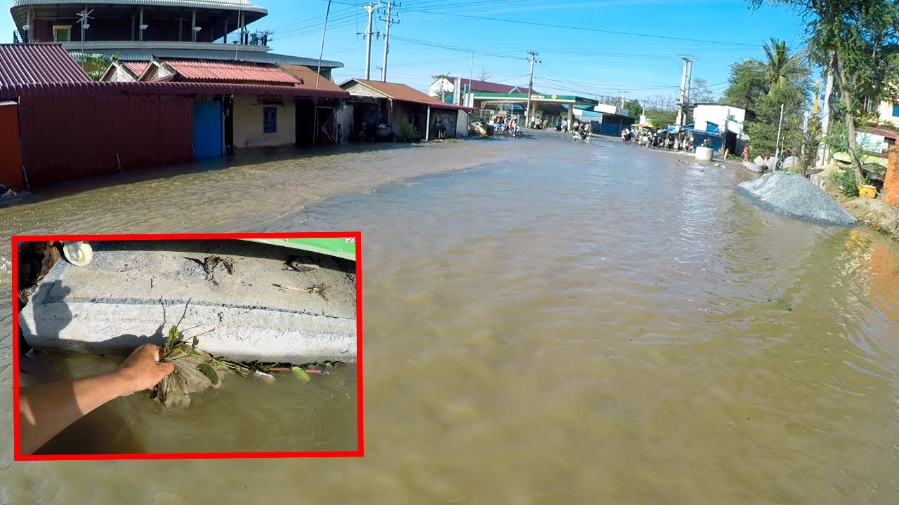 Removal Flood On Road To Culvert Drain - Clearing Trash And Plastic ...