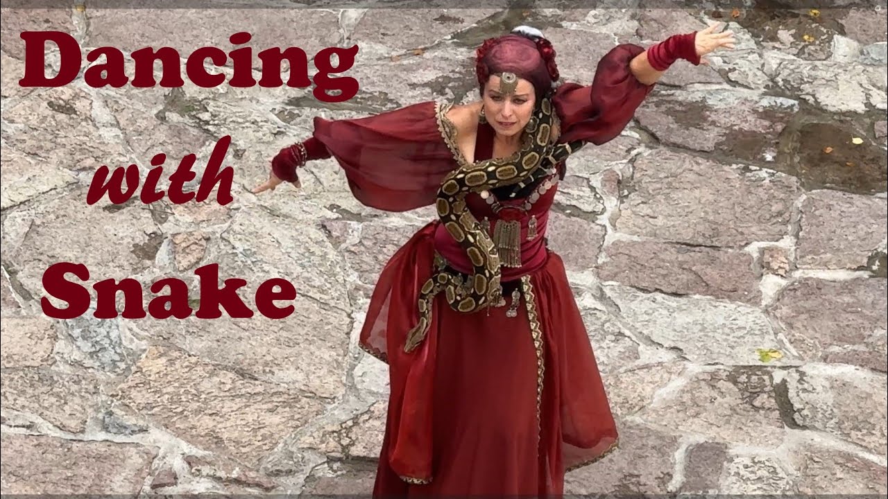 Belly dancing with a live snake. 26th Karlštejn Vintage Vine Festival ...