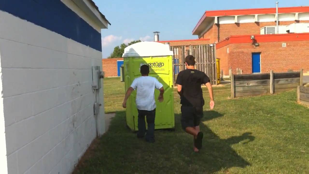 scot and matt tipping a porta potty - YouTube