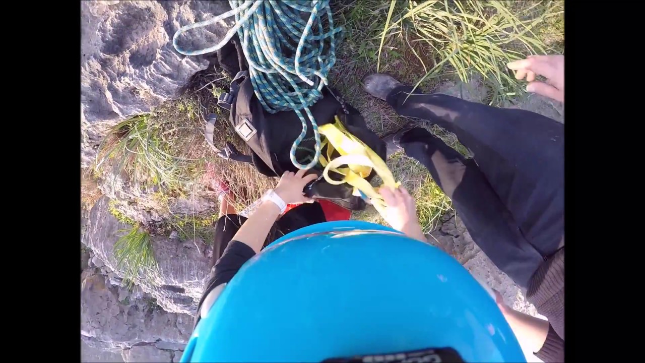 rappelling off a cliff using rope and petzl GRIGRI - YouTube