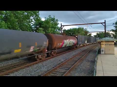 CSX M301 with friendly engineer and septa train at Olney Pa. - YouTube