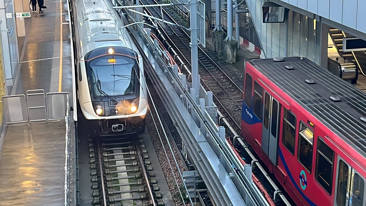 Elizabeth line and Docklands light railway trains at Custom House - YouTube