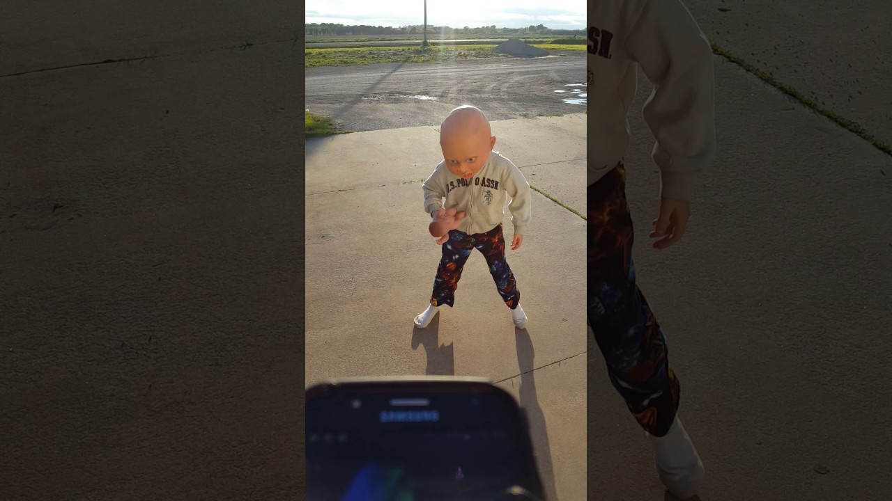Giant baby head dancing - YouTube
