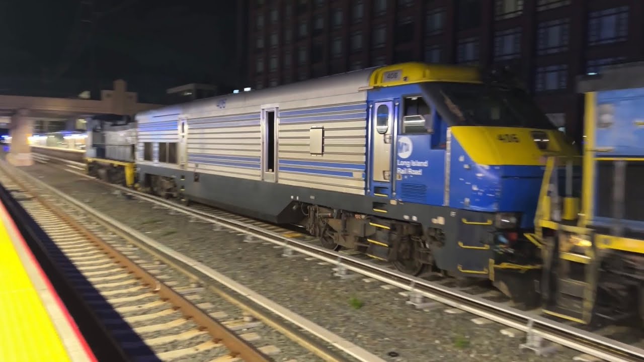 LIRR MP15AC’s 158 and 165 bring LIRR DE30AC 406 west through Mineola ...