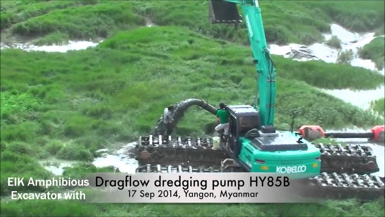 EIK AM200 amphibious excavator work with Dragflow dredging pump - YouTube