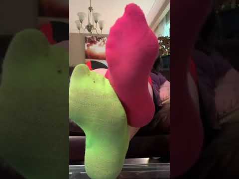 Cute girl shows off socks and soles