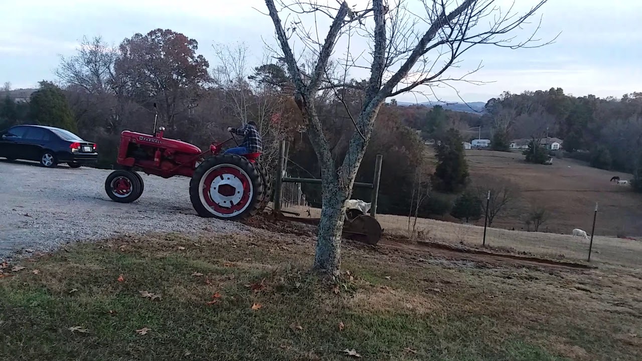 Farmall C with the tumble bug rotary scraper - YouTube