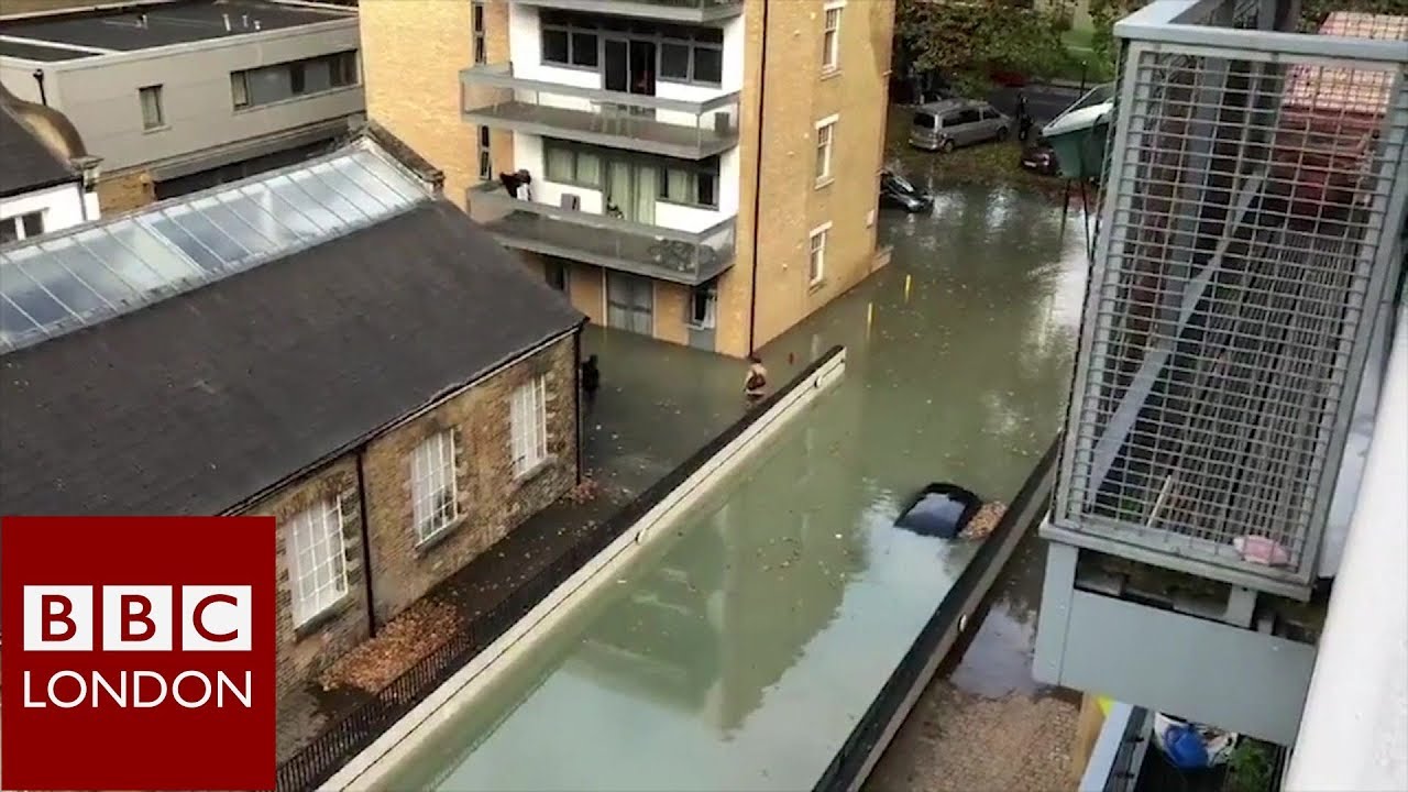 Residents in Hackney rescued from the flooding car park outside their ...