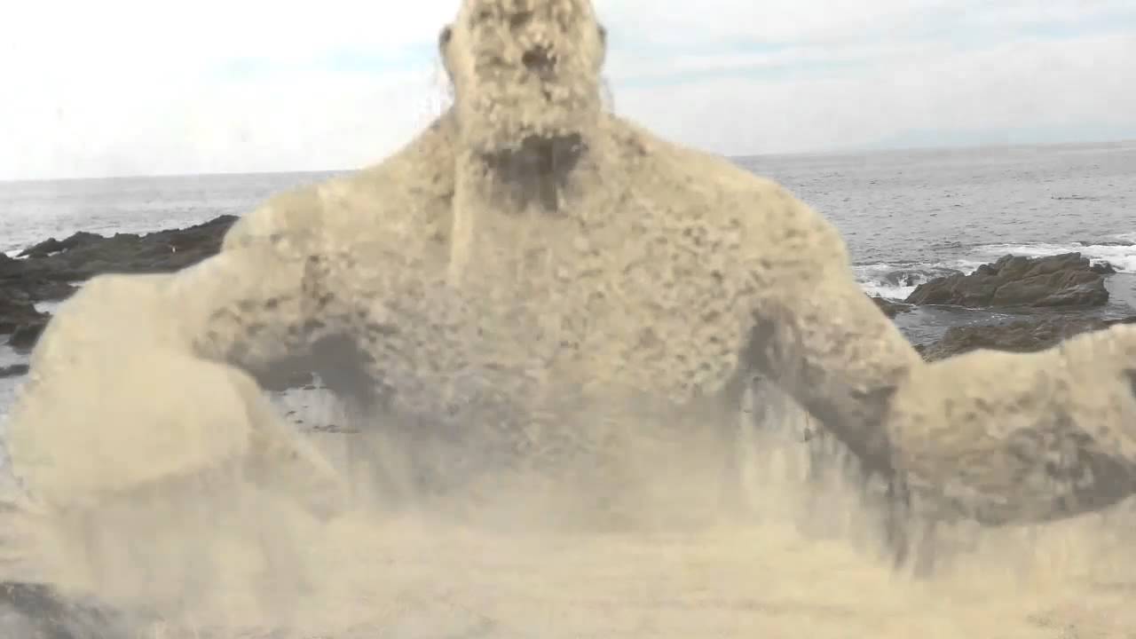 Giant Sand man coming up out of the beach inPuerto - YouTube