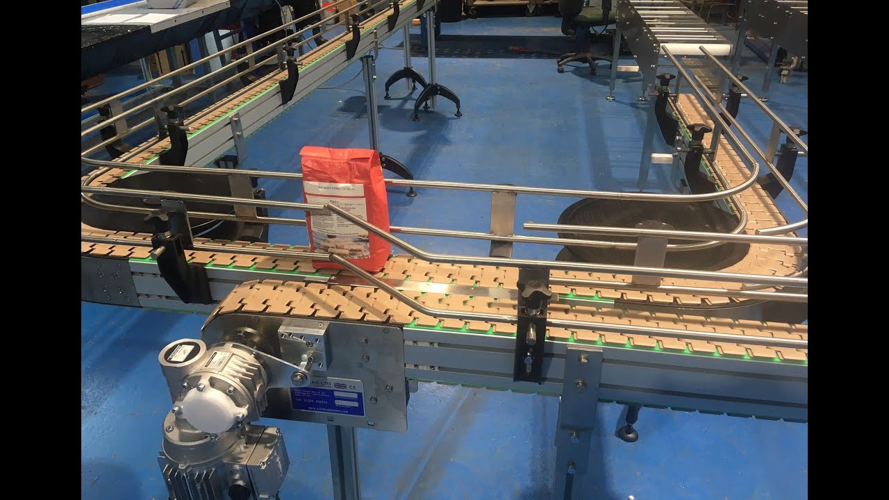 Narrow Slat Chain Conveyor handling bags of flour at UK based C-Trak ...