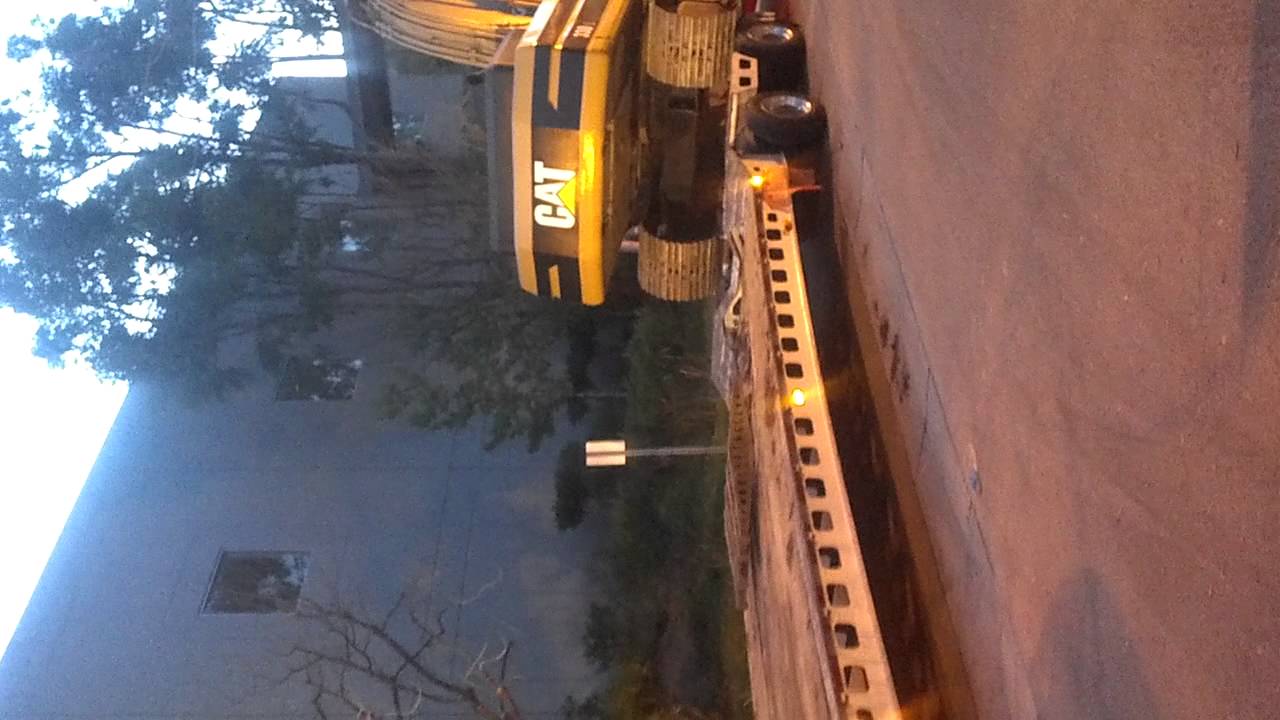 330 cat off loading on murray trailer - YouTube