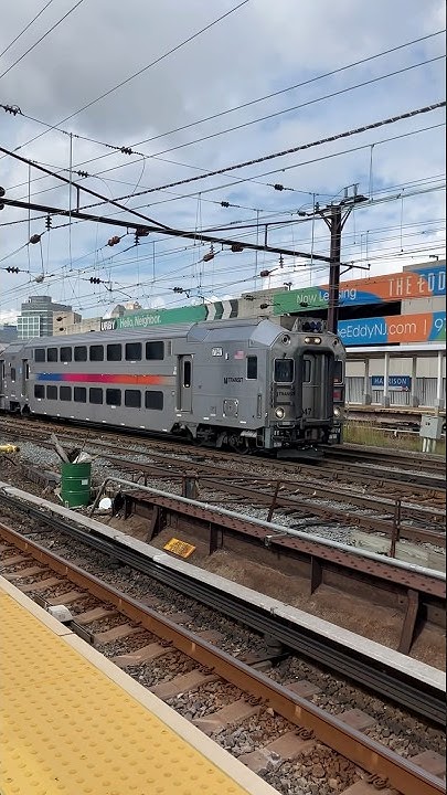 NJT multilevel, passing Harrison with horn salute - YouTube