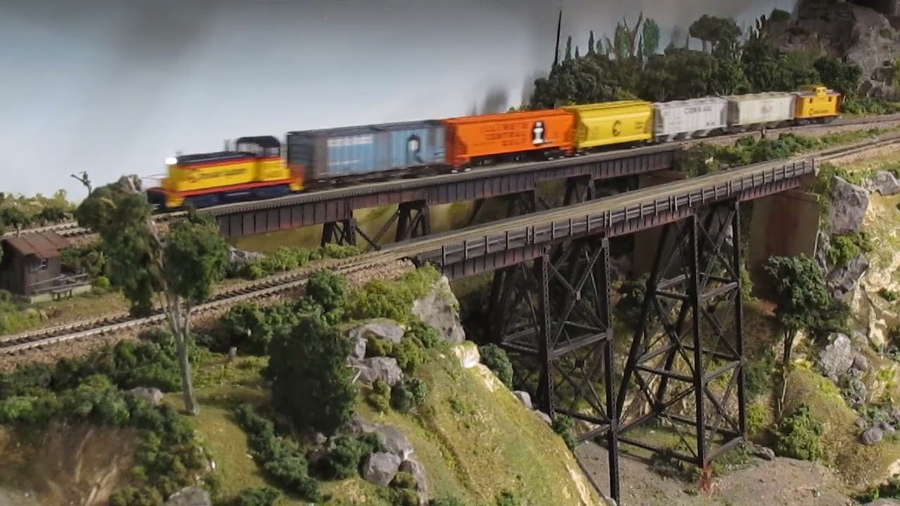 A 1970's era Chessie System R R covered hopper train, crosses the tall ...