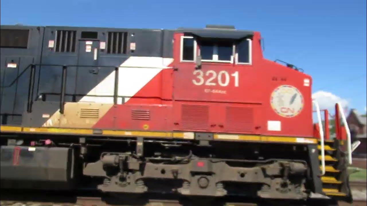 CN 3201, 2850, 8907 pull an Eastbound freight train with CNW, SSW, SP hoppers past Vicksburg, MI ...