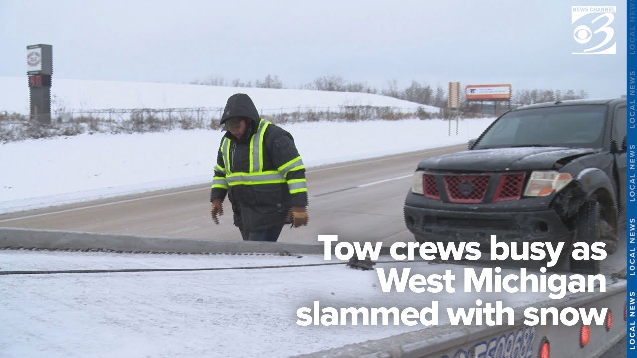 Tow crews busy as West Michigan slammed with snow - YouTube