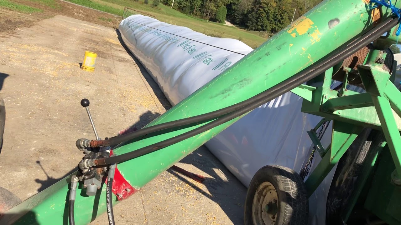 Grinding and bagging corn - YouTube