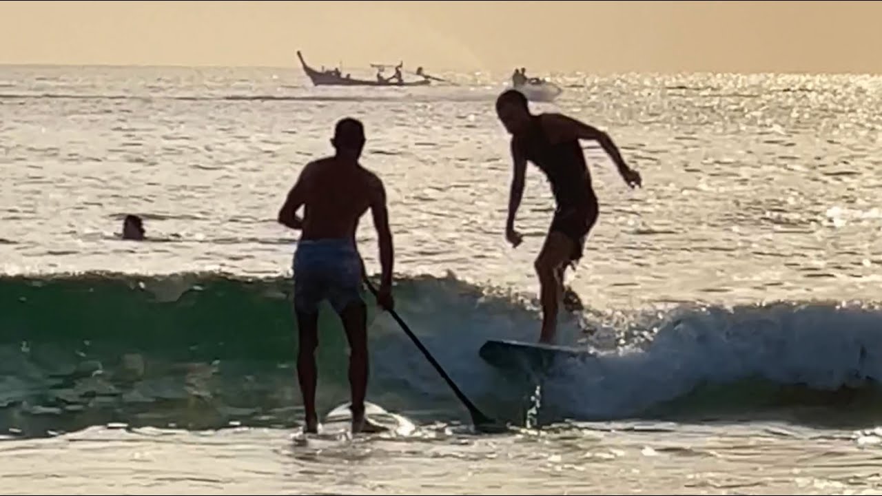 Surfer and SUP dangerously collide - YouTube