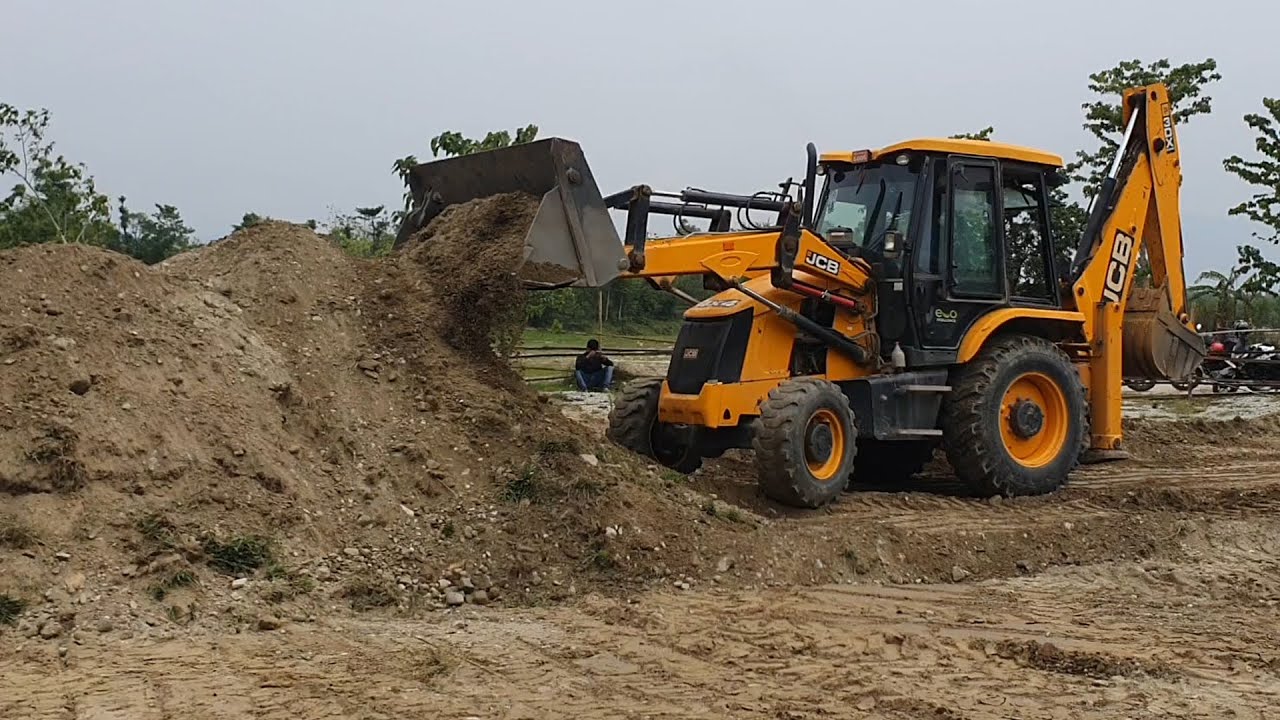 JCB Backhoe Collecting Dirt and Clearing Land To Plant Tree - JCB ...