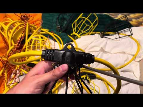 Putting metal cages on construction string lights - YouTube
