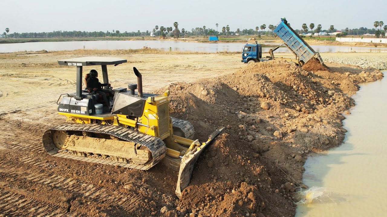 Best Bulldozer Komatsu Filling Land With Dump Truck Loading To Compact ...