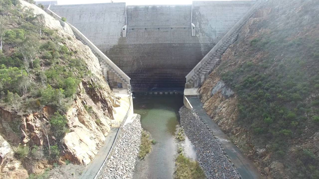 Cotter Dam spilling over for first time since new wall construction - YouTube