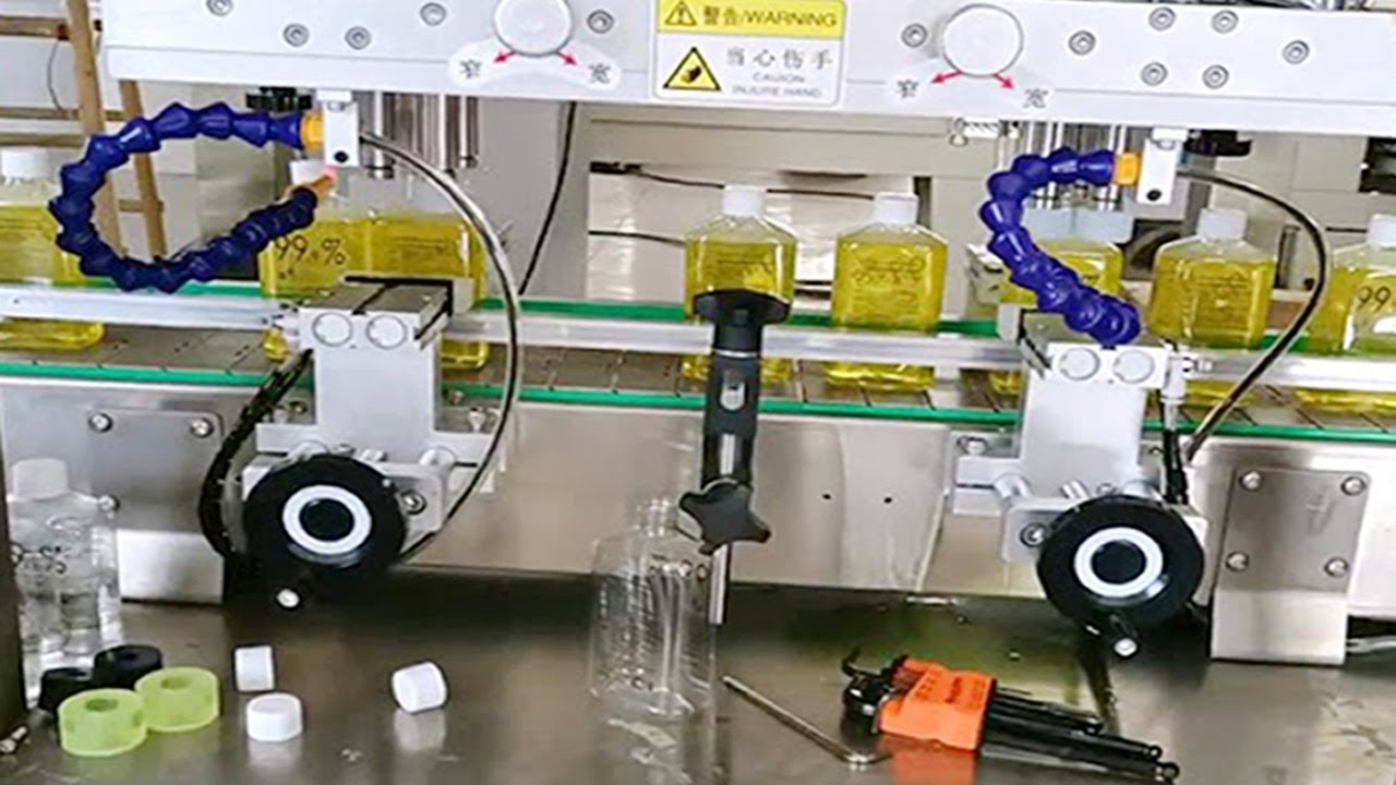 automatic tracking type bottles filling capping sealing machine two heads filler capper line ...