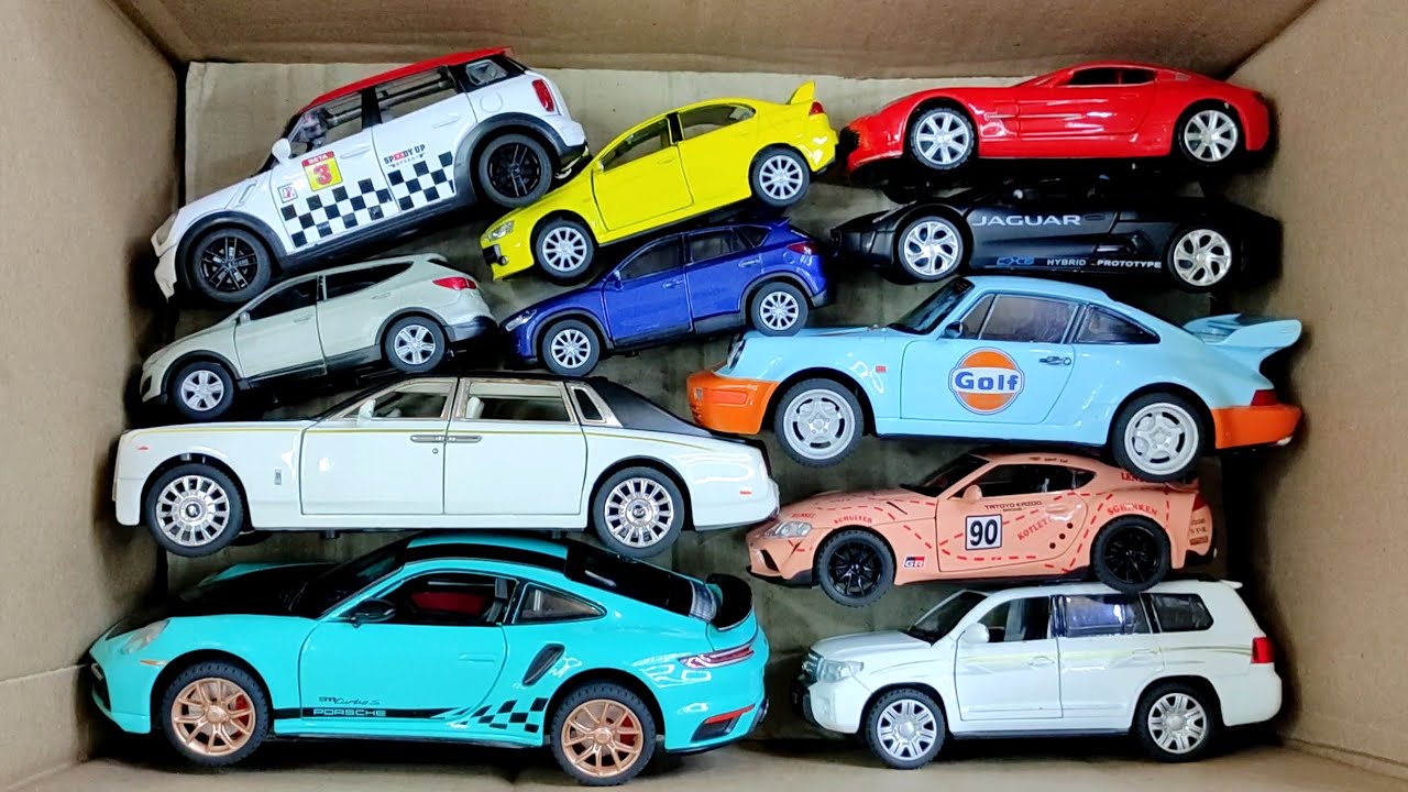 Box Full of Model Cars Land Cruiser, Honda Civic, Porsche, Rolls Royce ...