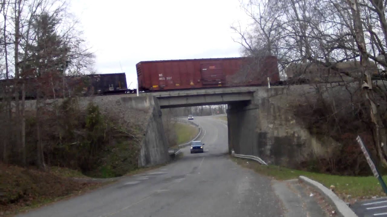 NS #8370 with UP GEVO leads a NS manifest across the bridge at Oneida ...