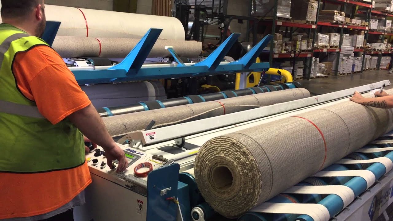 Accu Cut feed table in action dropping a roll onto the machine 1-800 ...