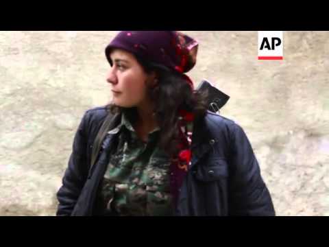 ONLY ON AP - INSIDE KOBANI Father and daughter reunited on the frontline of battle against IS group