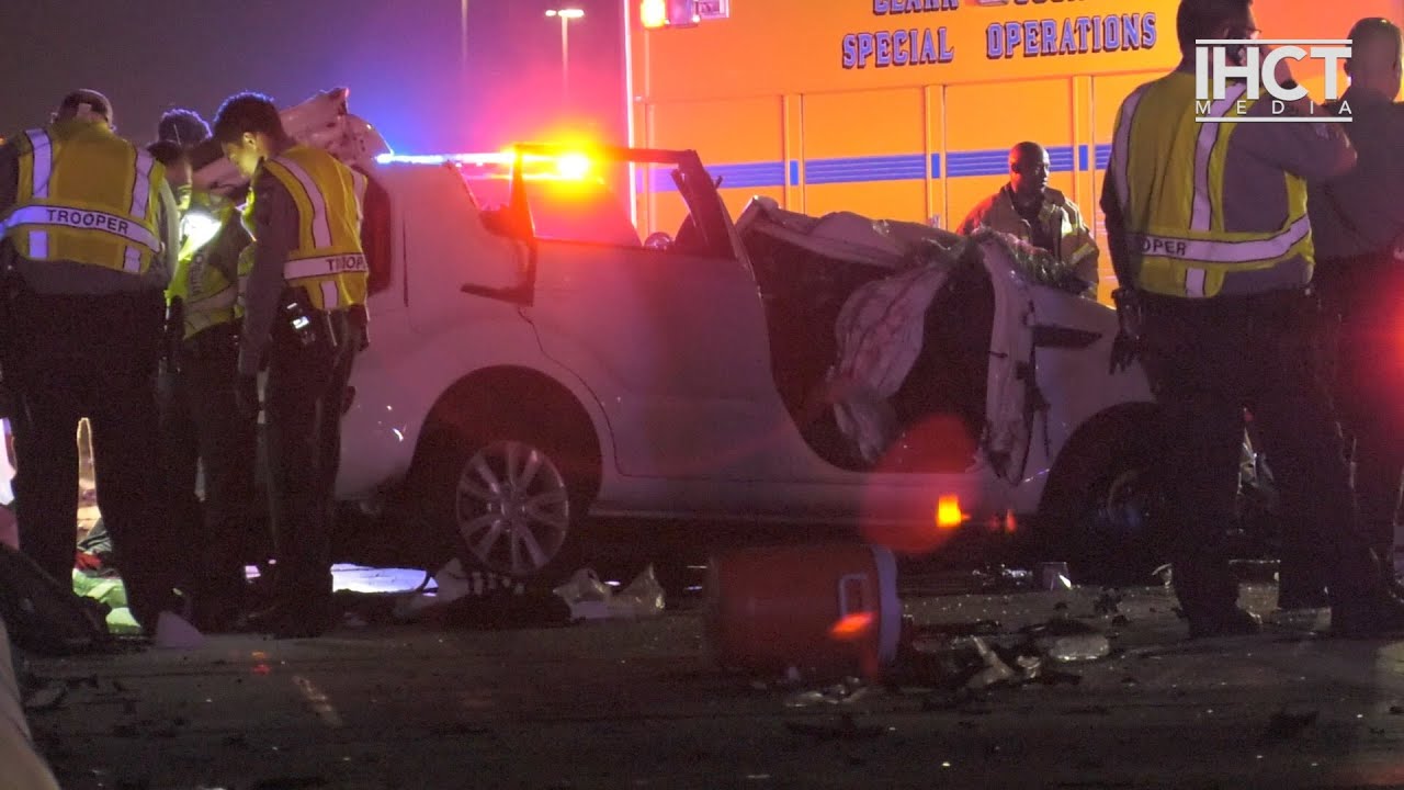 Firefighters rescue person trapped in rollover crash on freeway - YouTube