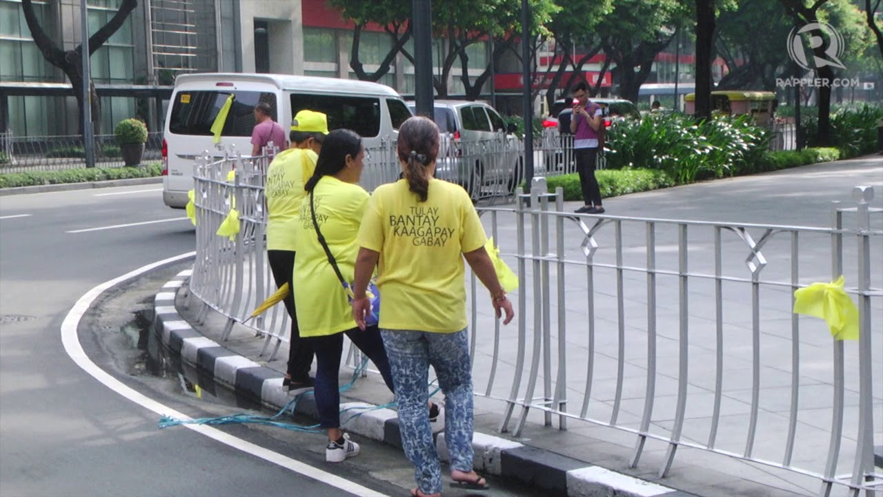 Supporters tie yellow ribbons for Ninoy's 35th death anniversary - YouTube