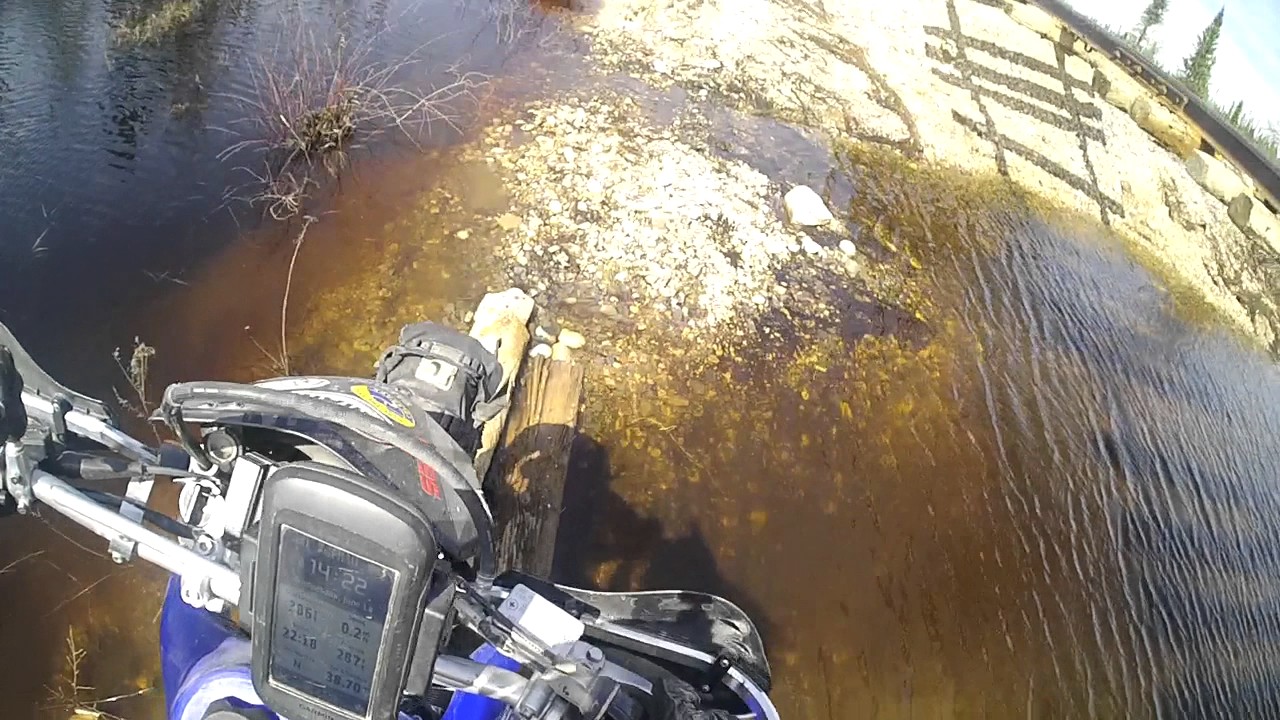 Motorcycle Takes Treacherous Path Around Washed Out Train Tracks - YouTube