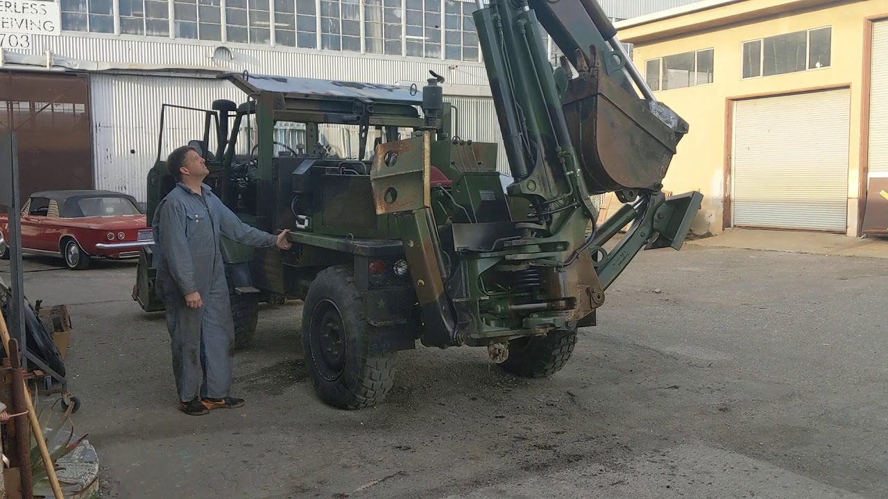 Unimog backhoe storage - YouTube