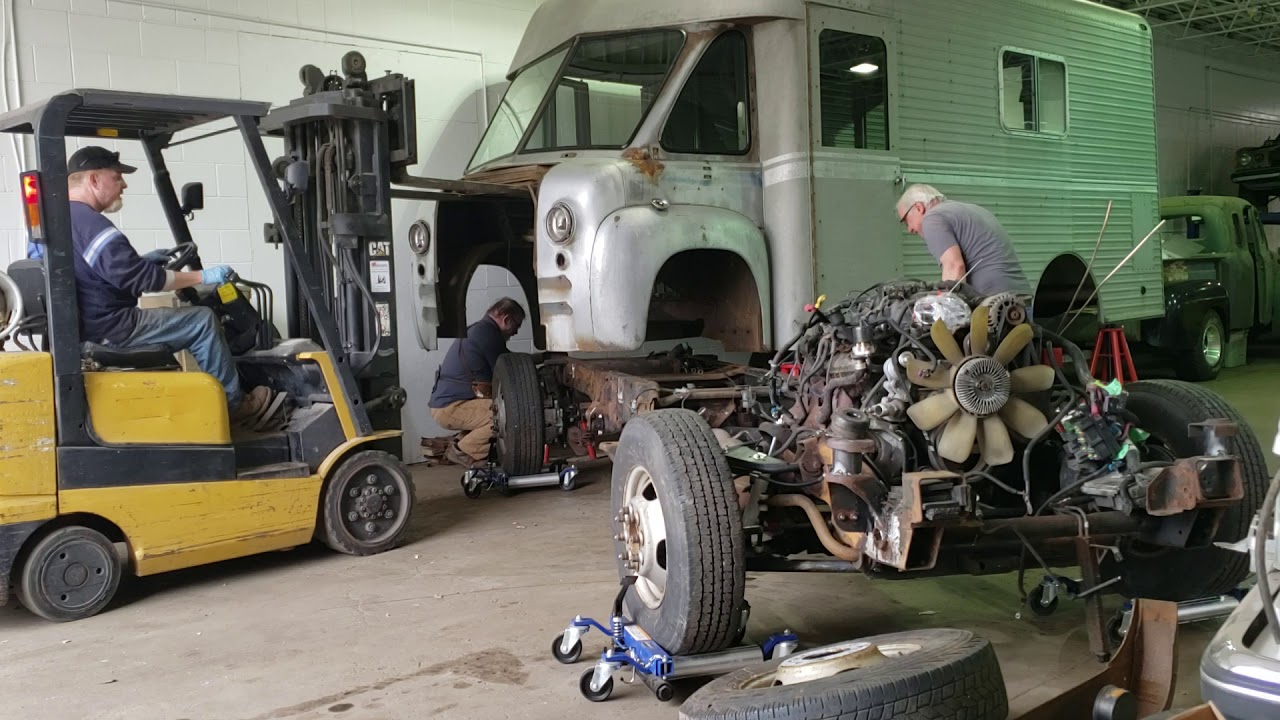 Moving the new chassis under the Dodge Route van body - YouTube