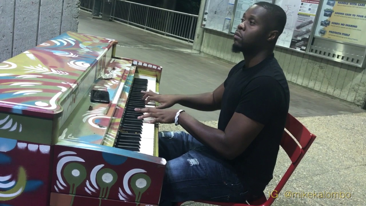 Mike Kalombo Playing an Outside Piano - YouTube