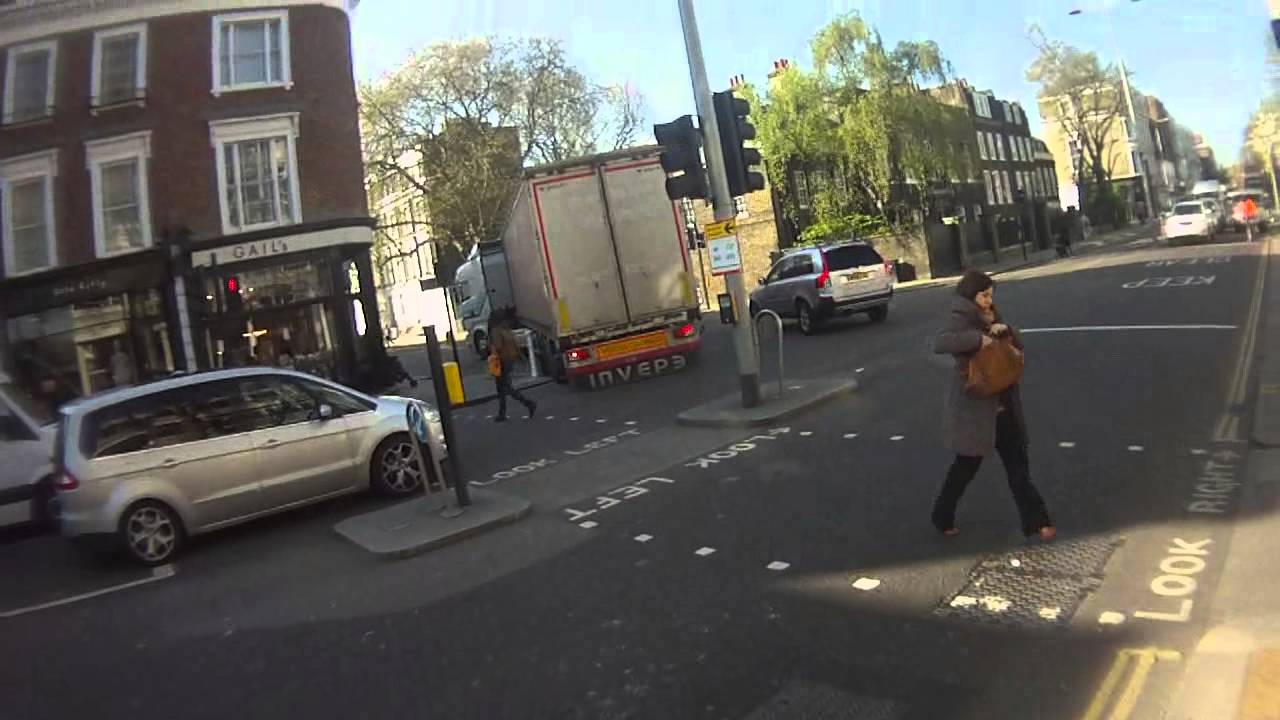 Articulated lorry gets stuck turning in London, and driver puts himself ...