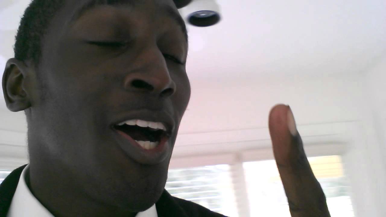 Slowly rotating black man - YouTube