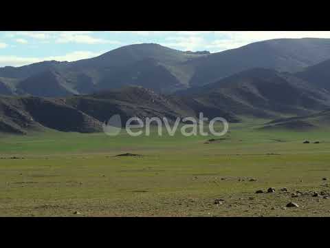 Green Flat Plain Next to Treeless Hills | Stock Footage - Envato ...