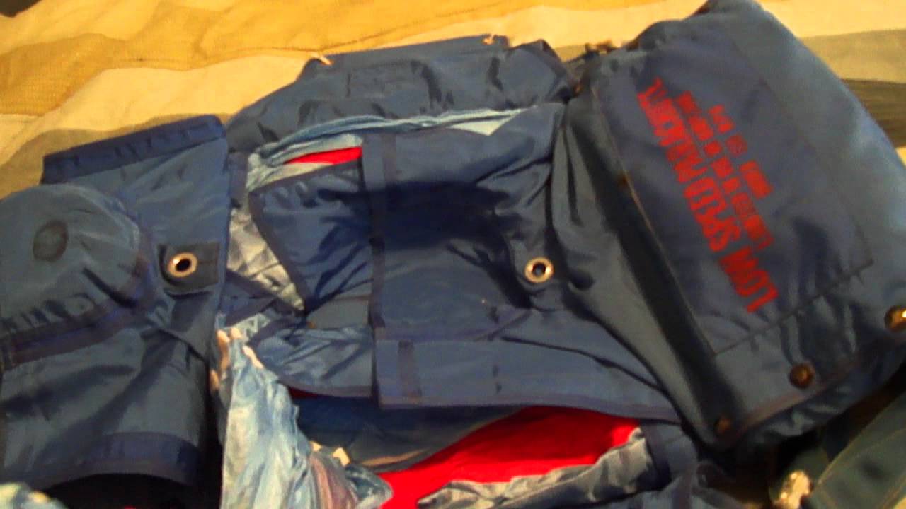 opening of Security 150 parachute for inspection - YouTube