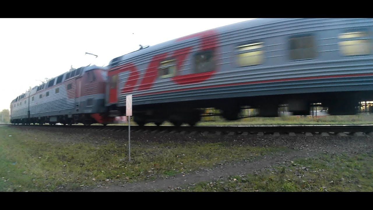 Czech electric locomotive CHS7 with a passenger train goes into the ...
