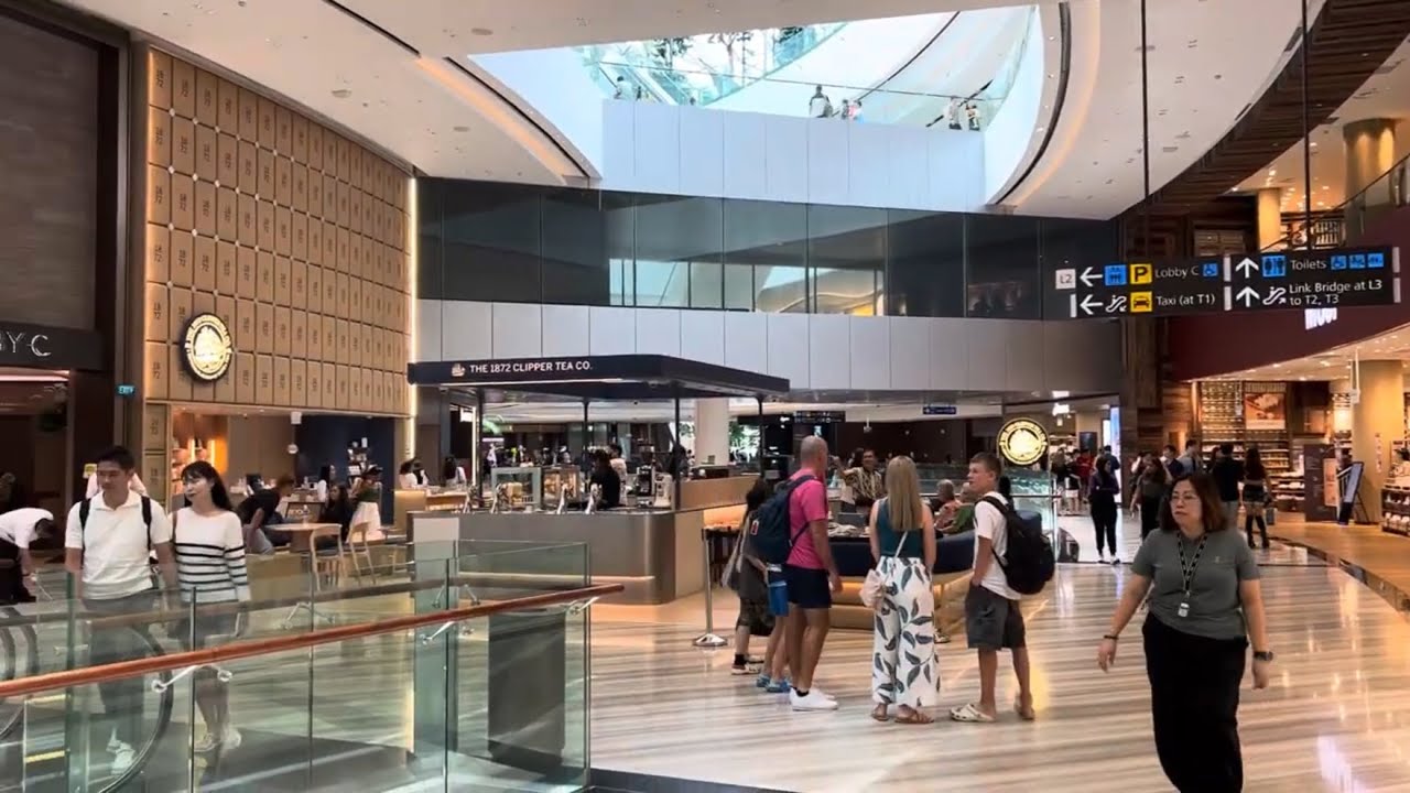 Wide neat shopping mall at the Jewel, SG airport - YouTube