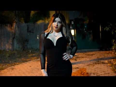 Blonde crossdresser in tight dress outdoors