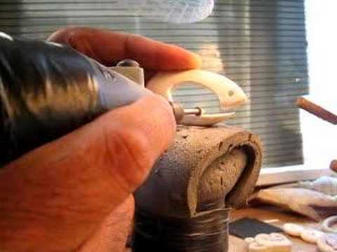 carving a bone fish hook pendant - YouTube