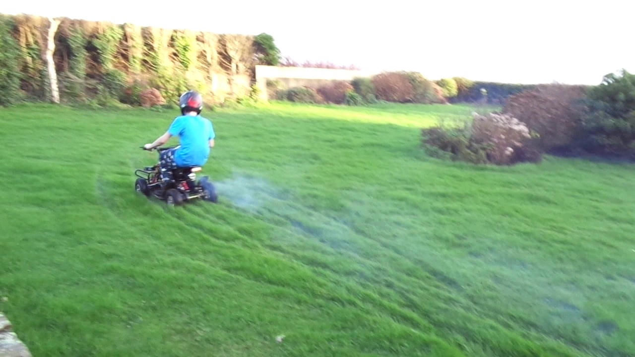 49cc Mini Quad in Grampy's Garden - YouTube