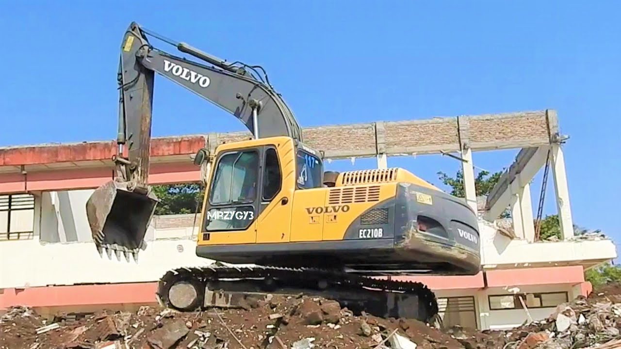 Demolition Excavator Loading Clearing Debris Volvo EC210B - YouTube