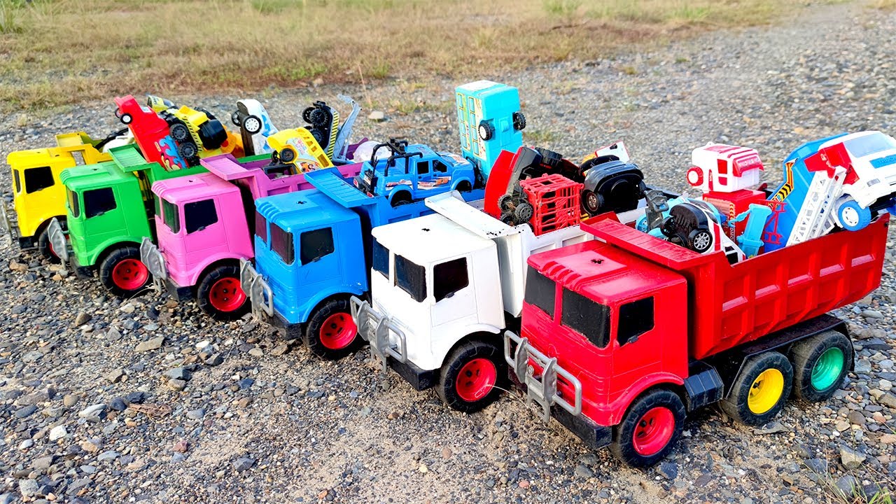 Car Long truck carries toy cars, police cars, buses, bulldozers ...