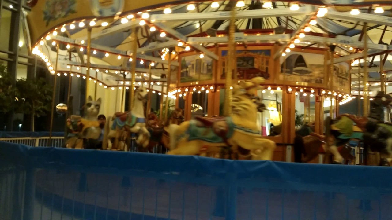 At the carousel in the mall - YouTube