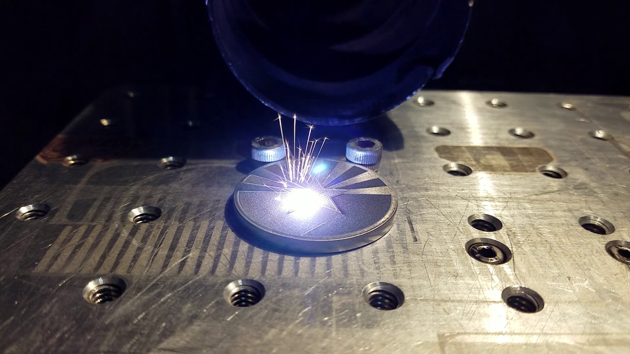 Deep engraving a titanium coin - YouTube